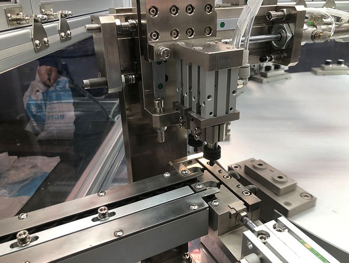 On-pipe pressure compensated dripper fully automatic assembly